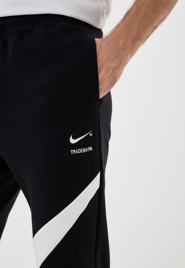 Брюки спортивные Nike M Nsw Swoosh Tch Flc Pnt цвет черный